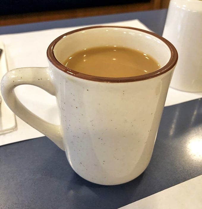 The humble diner coffee mug—holding what might be the most honest beverage in America, no frills, no foam art, just liquid motivation.