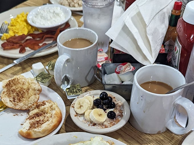 Morning rituals don't get better than this: steaming coffee, English muffins with cinnamon, and oatmeal topped with fresh fruit – breakfast of champions.