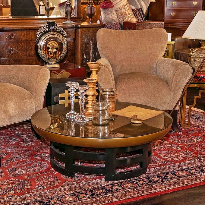 This isn't just a coffee table—it's a stage where crystal candlesticks and vintage treasures perform their daily show for appreciative audiences.