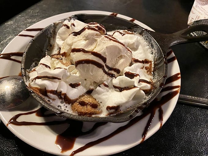 Dessert that understands its mission: warm cookie, cold ice cream, chocolate drizzle, and zero judgment about the steak you just demolished. 