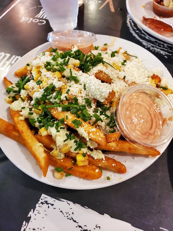 Elote fries—where street corn meets French fries and creates the side dish equivalent of finding money in your old jacket pocket.