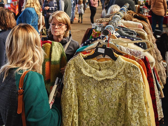 Fashion archaeology in action – where vintage clothing enthusiasts sift through decades of style, searching for that perfect piece from another era.