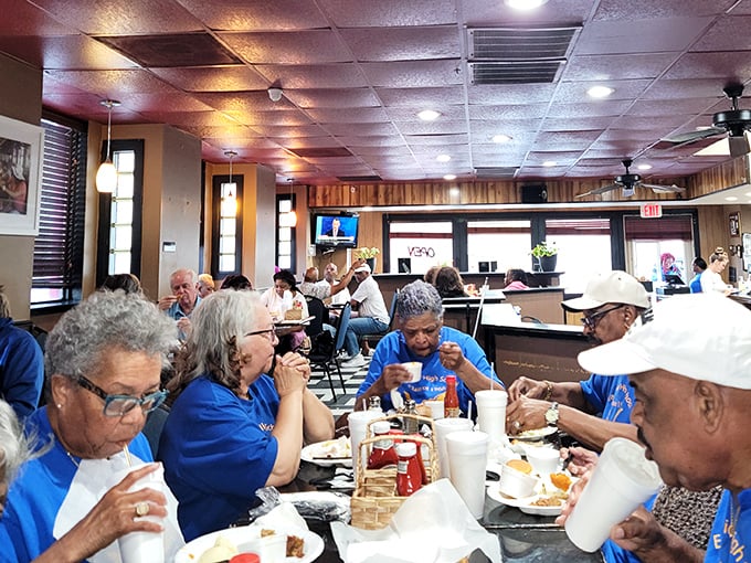 The dining room filled with happy customers – where strangers become temporary family, united by the universal language of "mmm" and "pass the napkins."