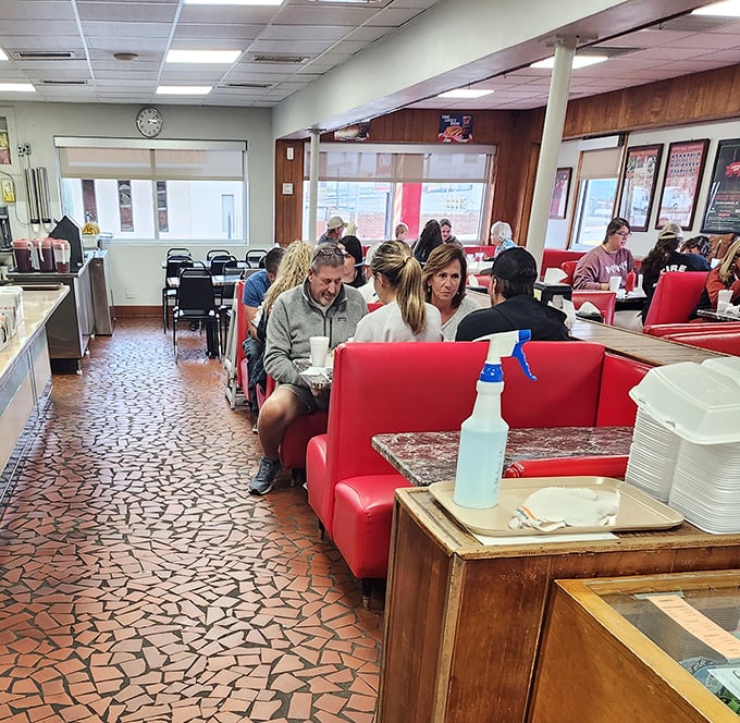 The dining room hums with the universal language of satisfaction – red booths filled with locals who know exactly why you made the drive to Lexington.