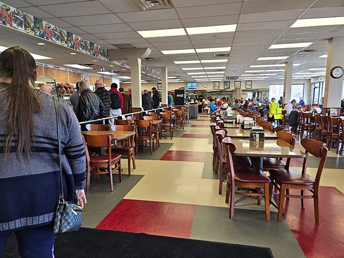 The checkerboard floor and wooden chairs have witnessed countless first dates, business deals, and family celebrations—all fueled by exceptional deli fare.