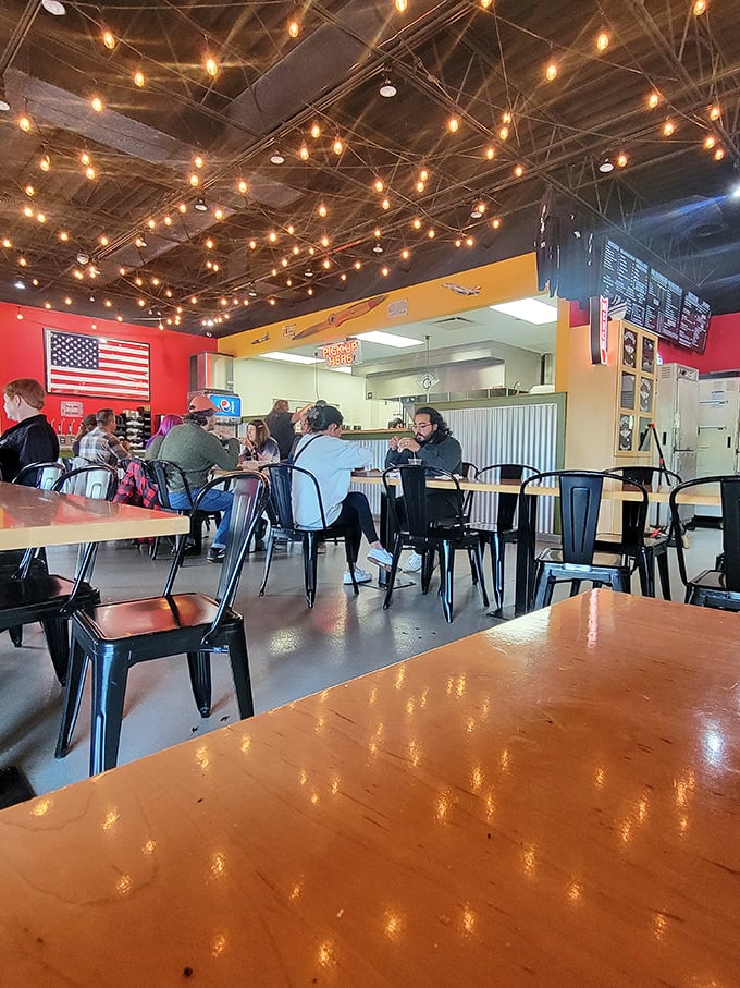 The dining room buzzes with the universal language of barbecue appreciation – the nodding heads and momentary silences that signal culinary bliss.