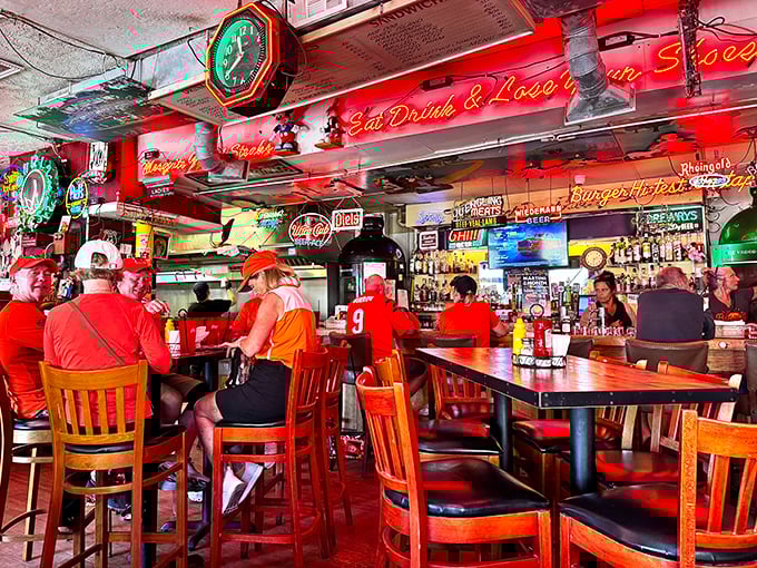 The bar area hums with the energy of people who've discovered that great food tastes even better when surrounded by the warm glow of vintage neon and cold beer.