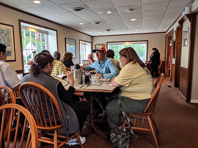 The dining room hums with the symphony of forks against plates and genuine conversation. No Instagram posing—just people actually enjoying their food.