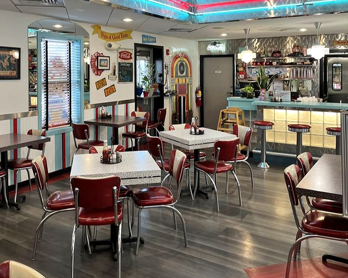 The dining area isn't just serving meals—it's serving memories with every chrome-edged table and vinyl chair that invites you to stay awhile.