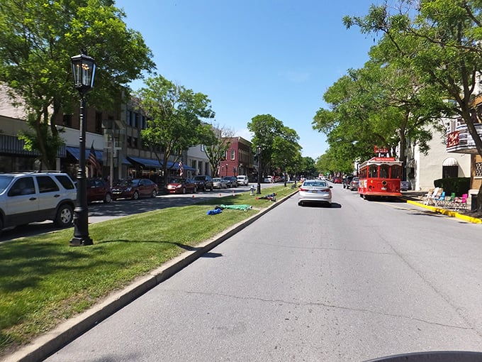 Wellsboro's downtown boulevard creates a European-inspired promenade. That red trolley isn't just for show—it's your chariot to affordable adventures.