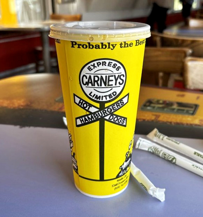 Probably the Best isn't just clever marketing—it's the understatement of the century printed on a cup that's as cheerfully yellow as the train car itself.