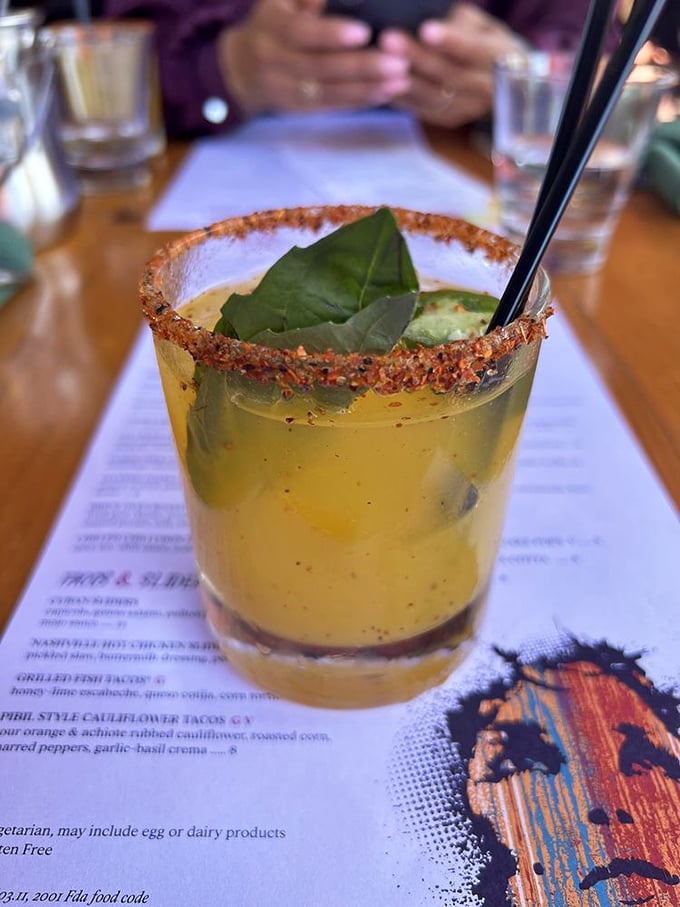 A cocktail with attitude—spicy rim, fresh basil, and enough personality to be the life of your table's party.