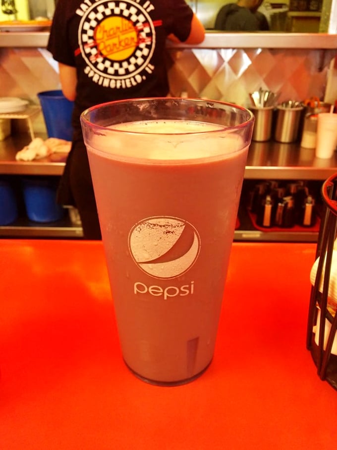 In the cathedral of breakfast, even the beverages demand proper respect. This frosty glass promises sweet relief between bites of savory morning magic.