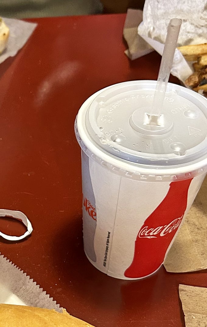 The classic soda in its natural habitat—ready to wash down sandwich perfection. Some relationships are just meant to be.