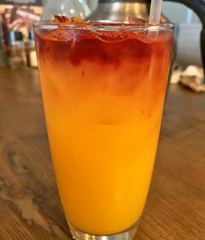 That layered sunrise in a glass isn't just a drink, it's morning optimism served cold. Orange juice never looked so photogenic.