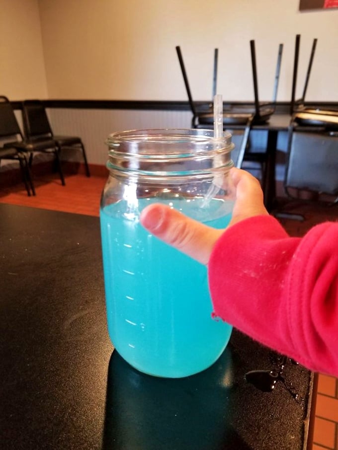 That electric blue drink isn't just refreshing—it's like sipping summer from a mason jar while your taste buds throw a pool party.