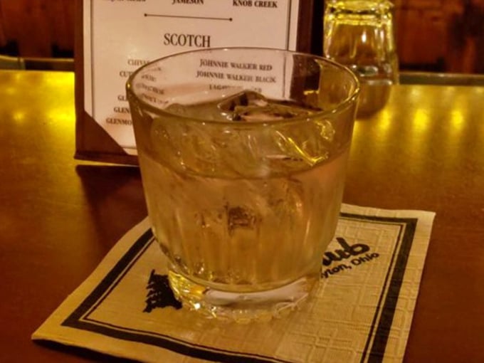 A properly made cocktail in a proper glass on a proper napkin – civilization still exists, and it's sitting right here on this bar.