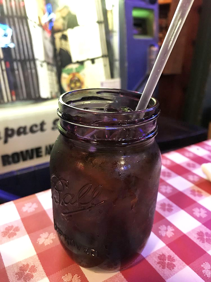 Sweet tea served in a Mason jar—because in Texas, proper hydration comes with a side of nostalgia and enough sugar to fuel a cattle drive.