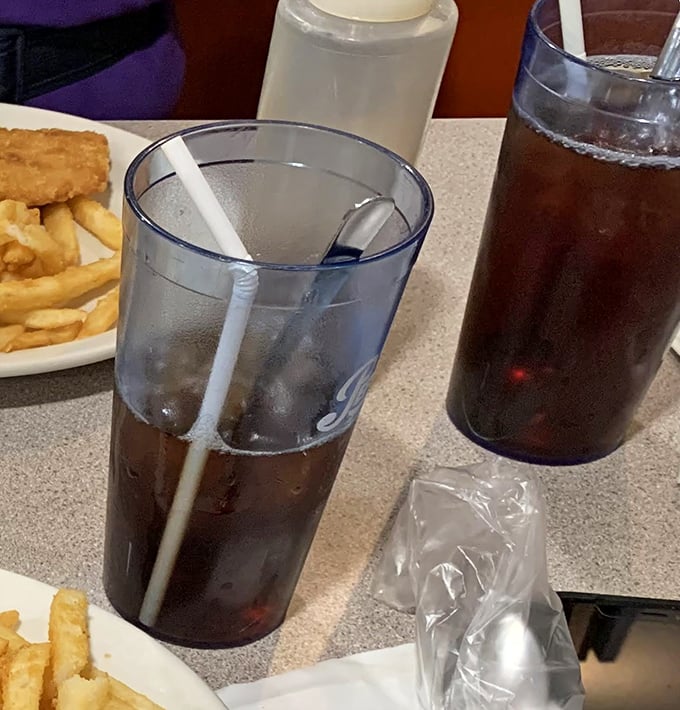 Classic diner beverages served in those iconic translucent plastic cups—where soda somehow tastes 37% better than anywhere else.