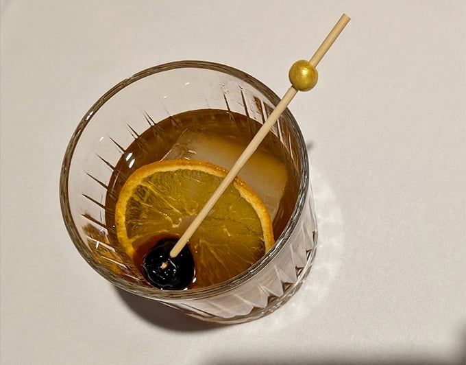 Cocktails at The Log Cabin aren't just drinks—they're liquid conversation starters, crafted with the precision of a Swiss watchmaker.