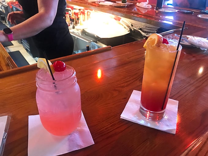Colorful cocktails that promise vacation vibes with every sip – because nothing says "I'm officially relaxing" like a drink garnished with fruit.