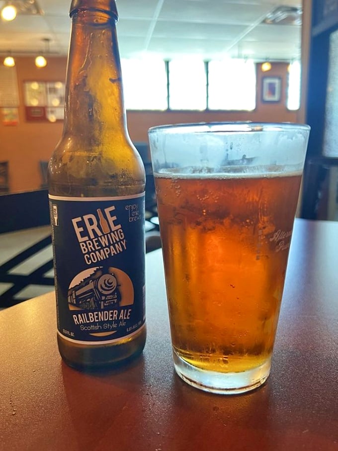 Local craft beer from Erie Brewing Company—because great food deserves equally thoughtful beverages. That amber glow is practically winking at you.