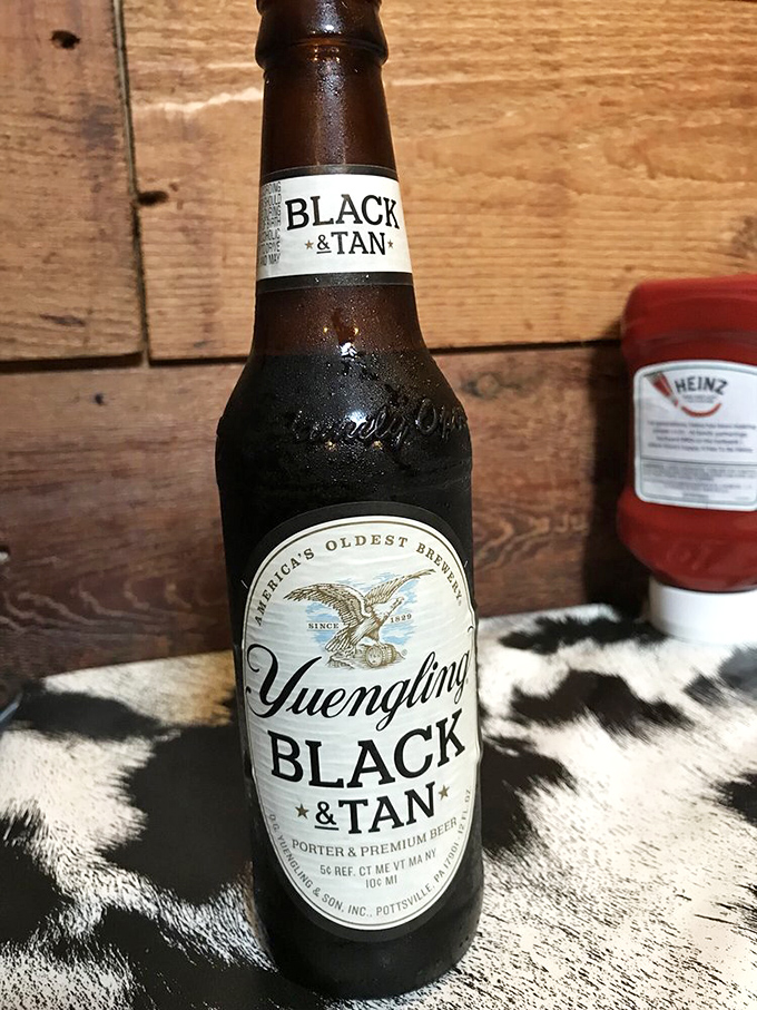 A Yuengling Black & Tan stands ready to complement your meal – because great steak deserves a worthy beverage companion.