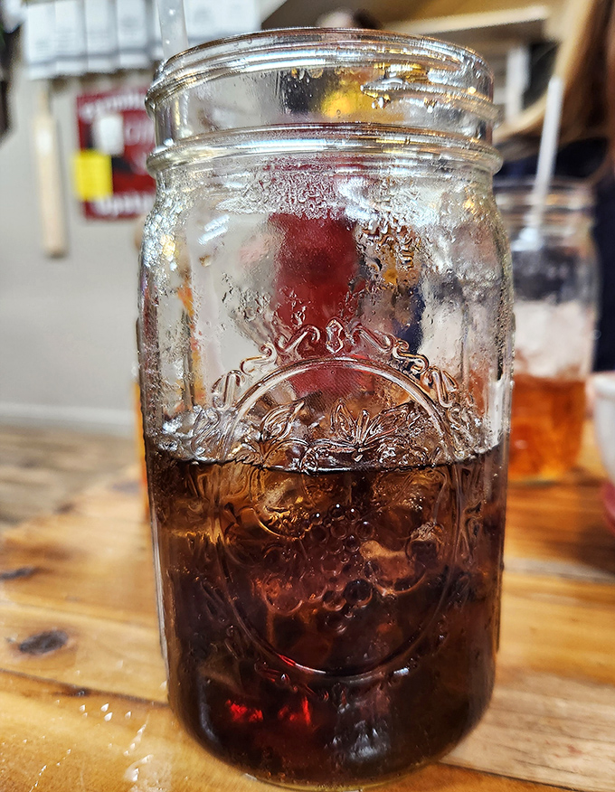 Sweet tea served in a Mason jar – because in the Ozarks, proper hydration comes with a side of Southern tradition and nostalgic glassware.
