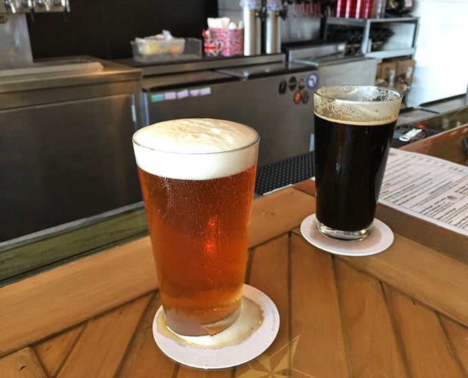 A perfect pint of amber ale alongside a stout as dark as London fog – liquid companions for your culinary journey across the pond.