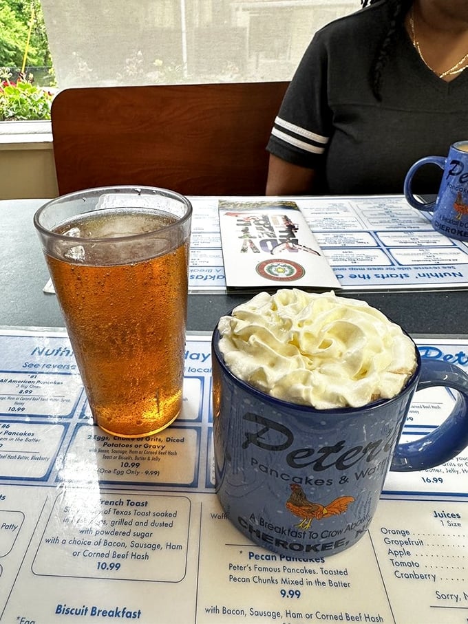 Hot coffee topped with whipped cream and sweet tea – the dual fuel system of the South. That mug isn't just holding coffee; it's holding liquid motivation.
