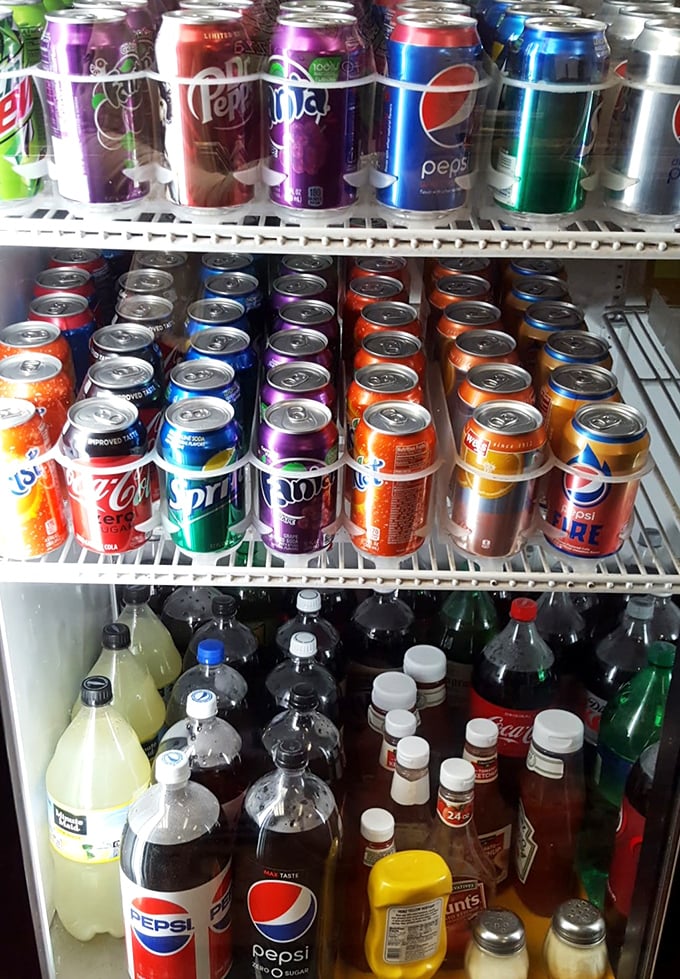 The beverage cooler—where decisions are almost as important as your pizza topping choices. Cold refreshment awaits to complement your meal.