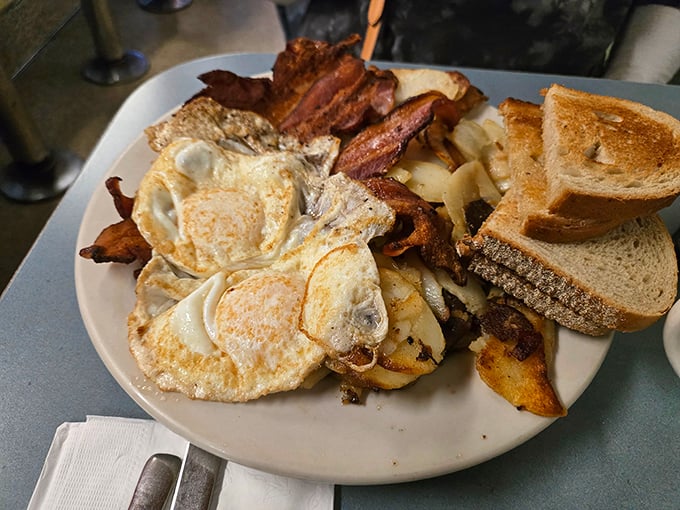 The classic American breakfast trifecta—eggs, bacon, and potatoes—executed with the precision of a culinary Olympic event. Simple food done right is never simple.