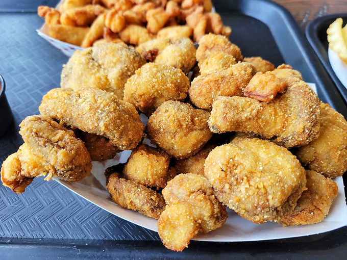 Mushrooms transformed into addictive golden morsels—proof that anything becomes magical when it meets Jolly Rogers' fryers and seasoning wizardry.