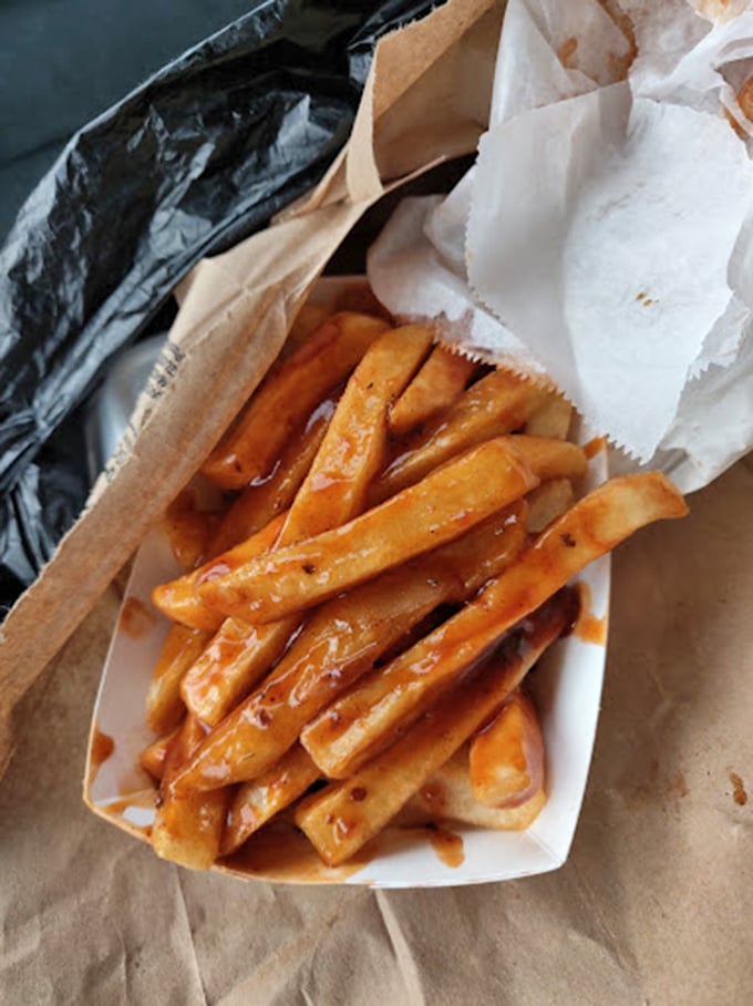 These aren't just french fries—they're sauce delivery vehicles, expertly engineered to transport that legendary barbecue elixir from plate to palate.