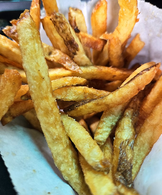 Hand-cut fries that actually taste like potatoes—what a concept! These golden beauties make you wonder why we ever complicated things with truffle oil.