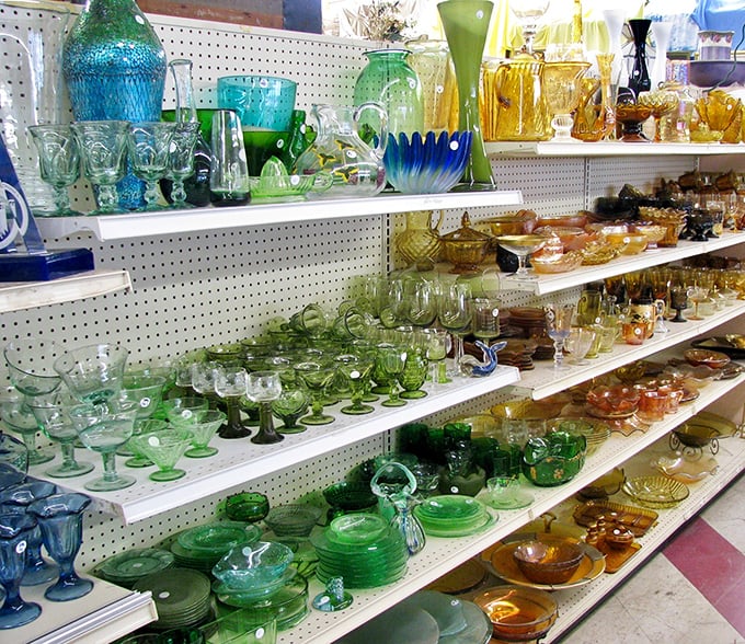 A rainbow of vintage glassware catches the light like jewels. Depression glass and mid-century pieces await collectors who know that dinner parties are more fun with conversation-starting tableware.