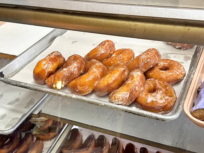 Glazed beauties glistening on trays like precious amber gems waiting for their perfect moment.