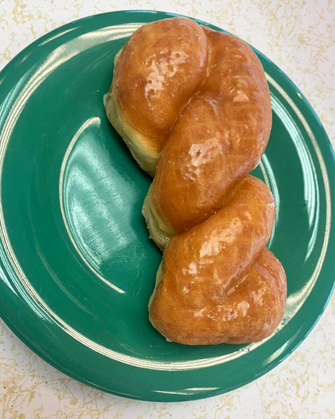 The glazed twist isn't just a donut—it's edible architecture, a golden braid of dough that somehow manages to be both substantial and ethereally light.