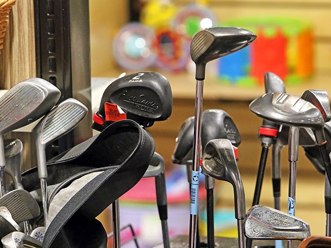 Golf clubs waiting for their second act – each one holding the ghosts of frustrated swings, triumphant putts, and countless "almost had it" moments.