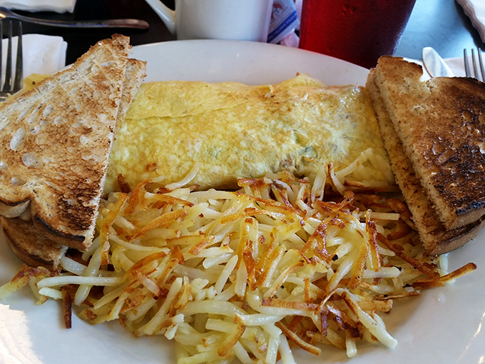 Hash browns that have achieved the impossible dream: crispy exterior giving way to tender interior—the texture that breakfast potatoes aspire to in their prayers.