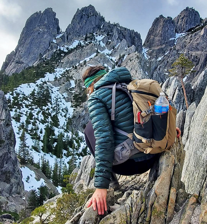The trail demands respect but rewards perseverance. This hiker's careful scramble will lead to views that make smartphone cameras feel woefully inadequate.