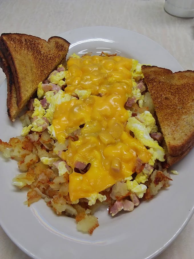 When cheese meets eggs meets hash browns meets ham, it's not just breakfast—it's an Ohio morning symphony on a plate.