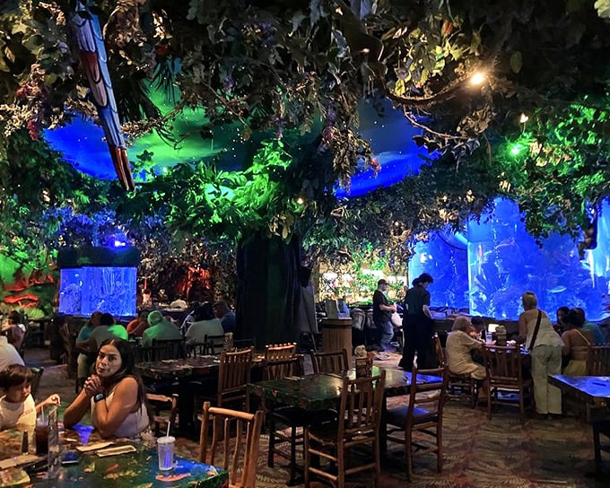 Blue lighting transforms ordinary dining into underwater fantasy—like eating inside an aquarium without the guilt of the fish watching you eat their friends.
