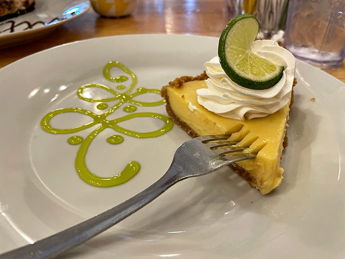 Key lime pie with that signature green swirl – tangy, sweet, and wearing a dollop of whipped cream like a jaunty beret.
