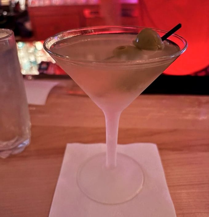 Crystal clear, ice cold, and perfectly balanced—this martini isn't just a drink, it's a time machine to the era when Sinatra ruled and dinner was an event.