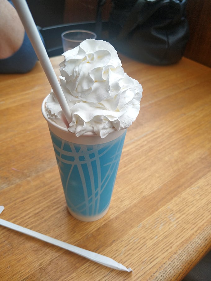 The milkshake mountain that requires both a straw and a spoon. This isn't dessert—it's an expedition with whipped cream as the summit flag.