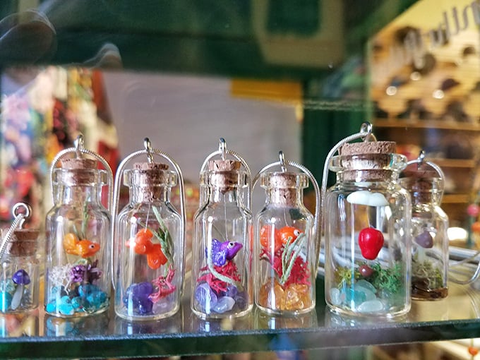 Tiny worlds captured in glass—these miniature bottle pendants are like Instagram filters for your neck, only more permanent.