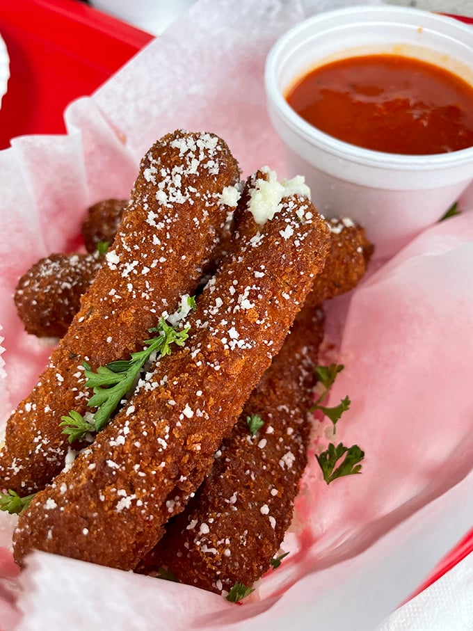 These mozzarella sticks aren't just appetizers—they're golden-brown ambassadors of cheese, wearing a crispy uniform and reporting for delicious duty.