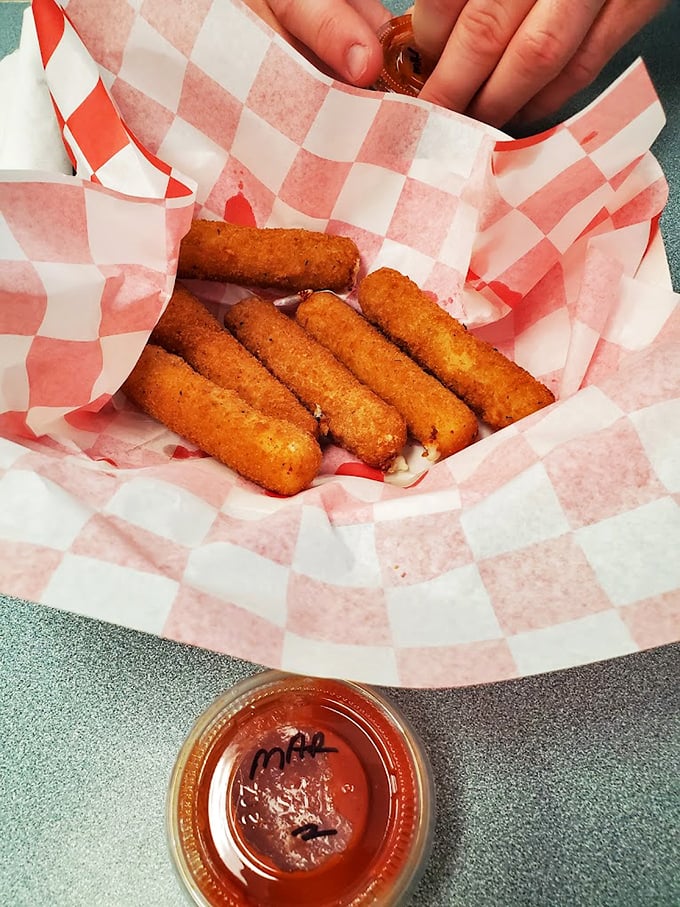 Golden-brown mozzarella sticks nestled in checkered paper—the adult version of finding money in your coat pocket.