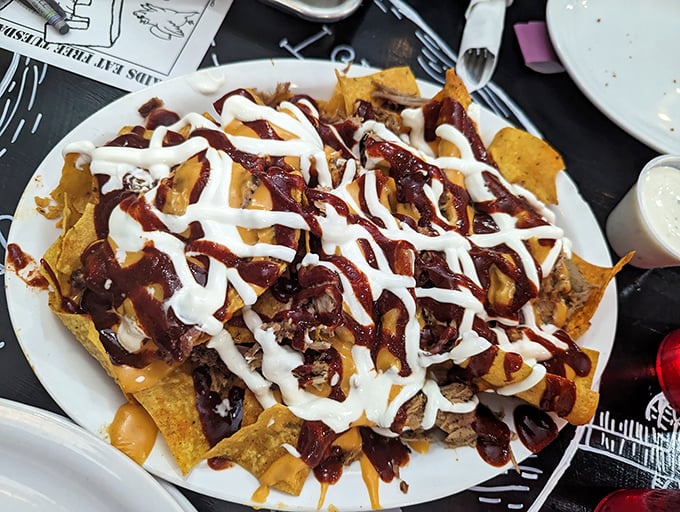BBQ nachos that laugh in the face of subtlety – a mountain of chips, meat, sauce, and cheese that requires strategy and stamina.